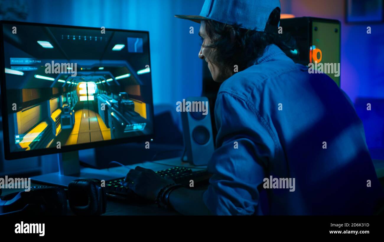 Excited Gamer Playing First-Person Shooter Online Video Game on His ...