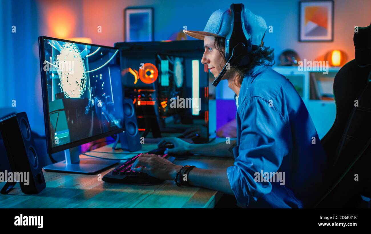 Professional Gamer Playing First-Person Shooter Online Video Game on ...