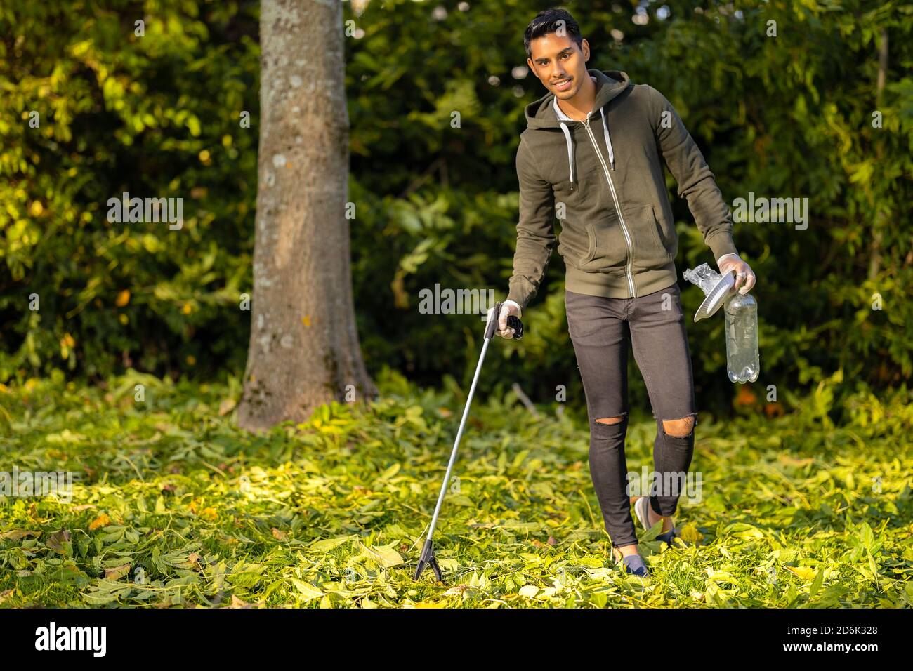 Volunteer conserving environment from pollution and plastic Stock Photo ...