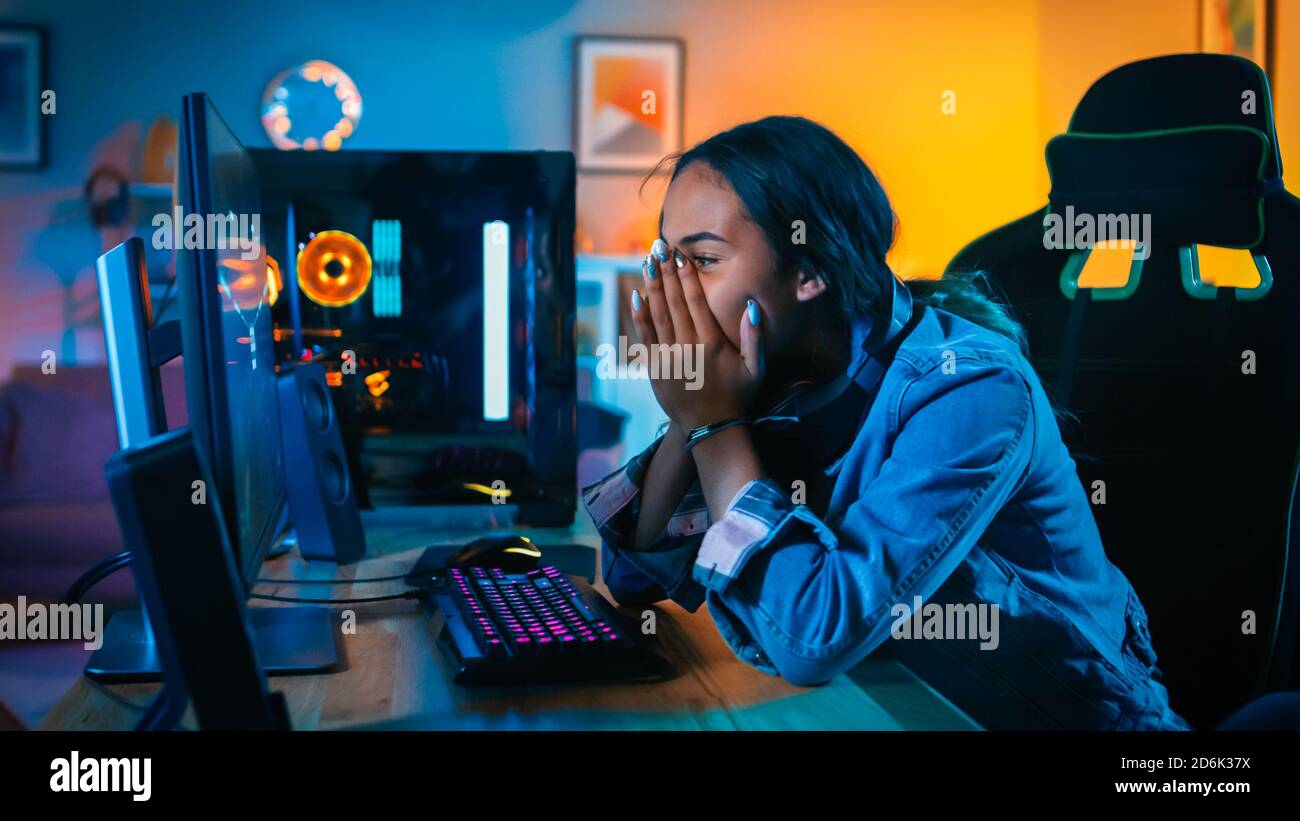 Pretty and Excited Black Gamer Girl in Headphones is Closing Her Face ...
