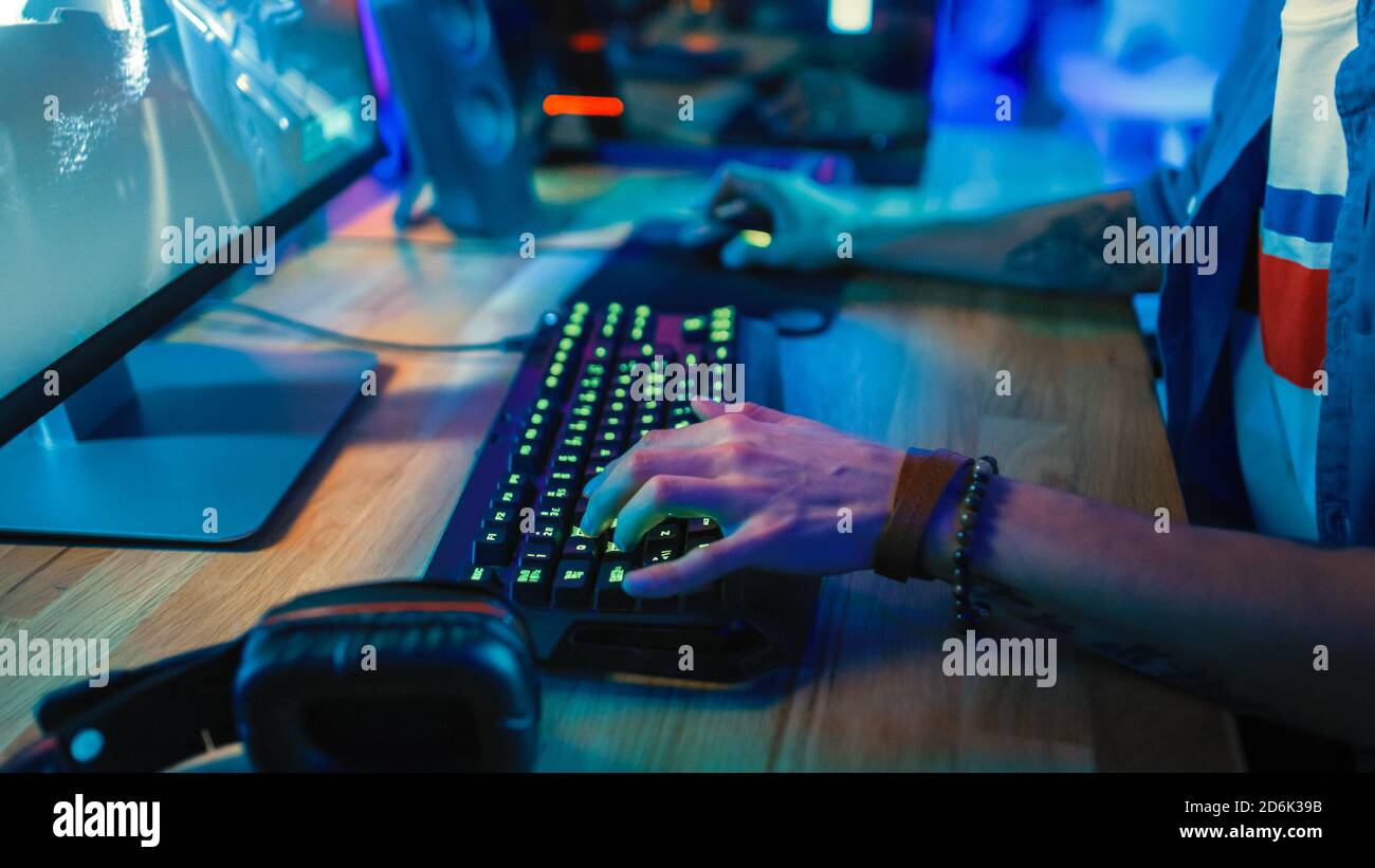 Close-Up Hands Shot Showing a Gamer Using the Keyboard while Playing an ...