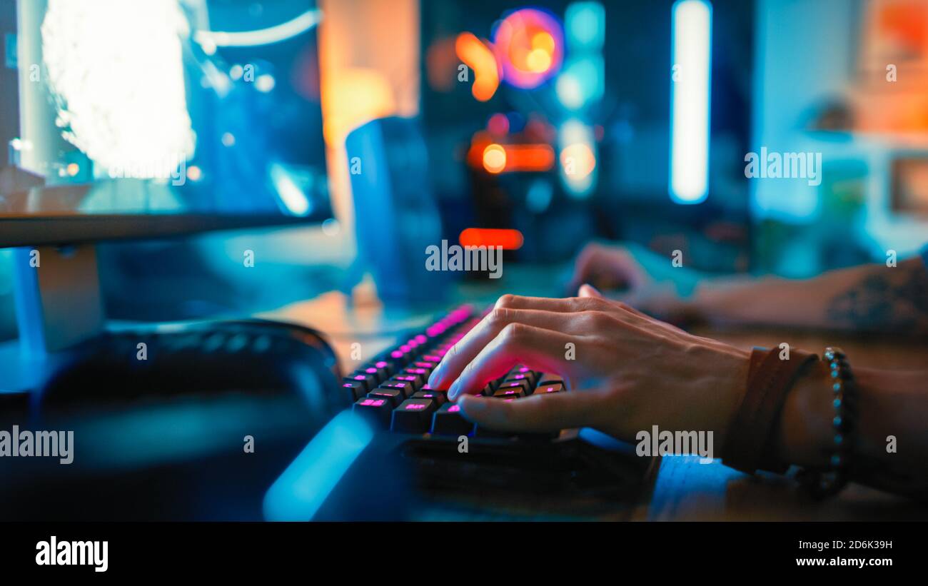 Close-Up Hands Shot Showing a Gamer Using the Keyboard while Playing an ...