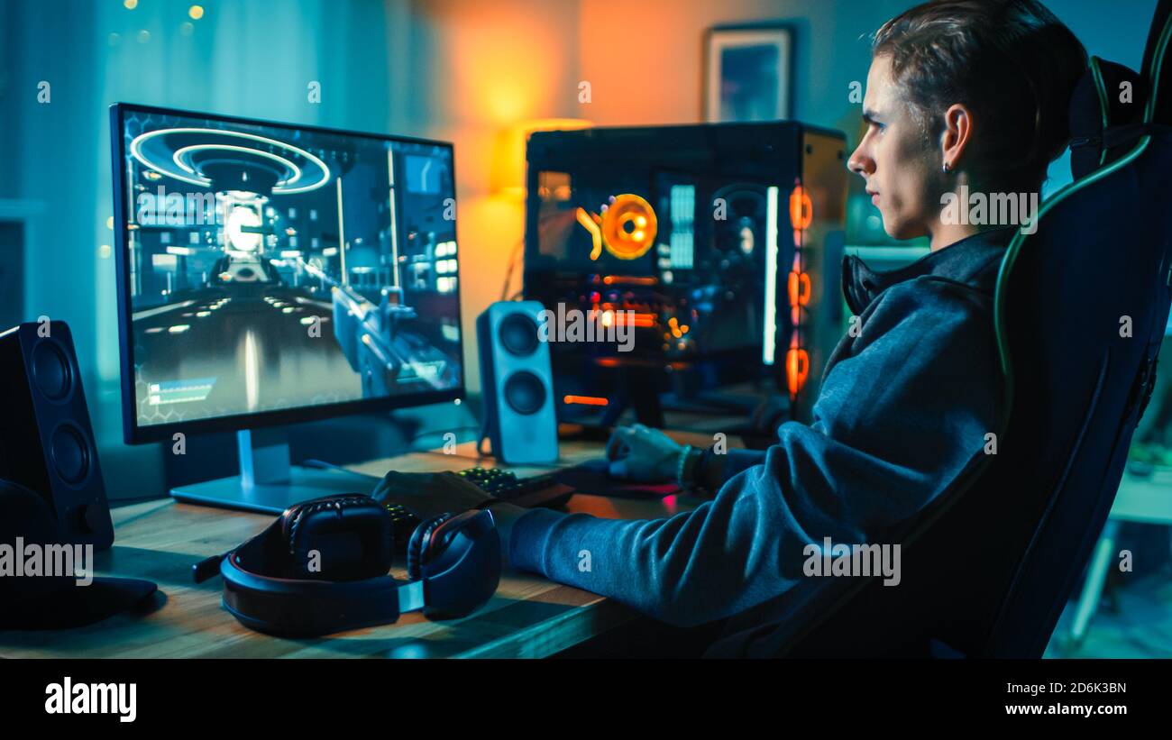 Cheerful Gamer Playing First-Person Shooter Online Video Game on His ...