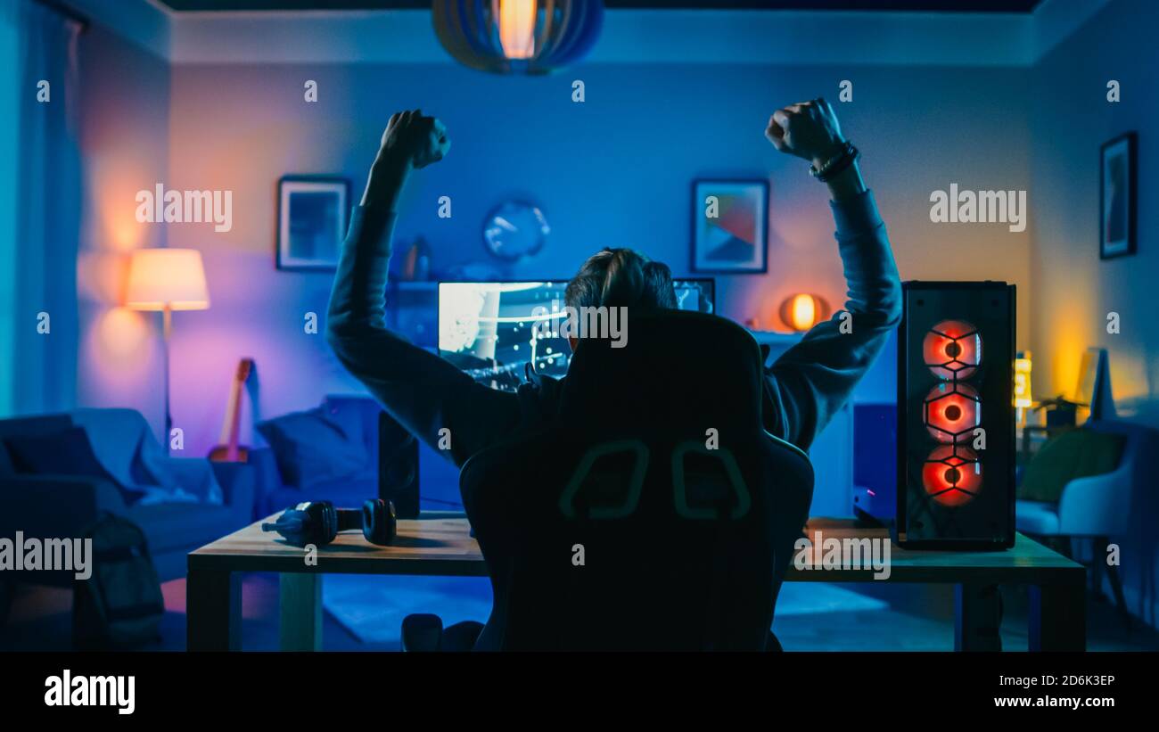 Back Shot of a Gamer Playing and Winning in First-Person Shooter Online ...