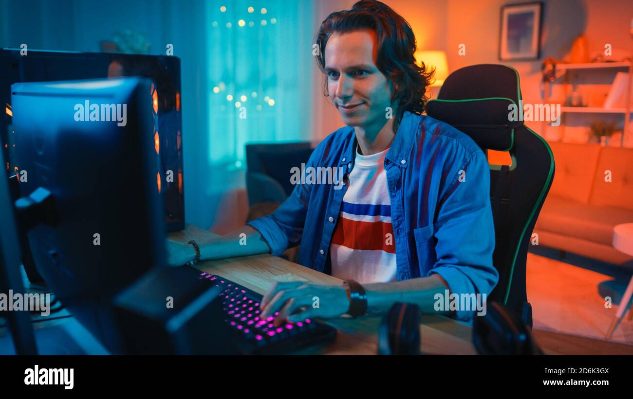 Excited Gamer Playing Online Video Game on His Personal Computer. Room ...