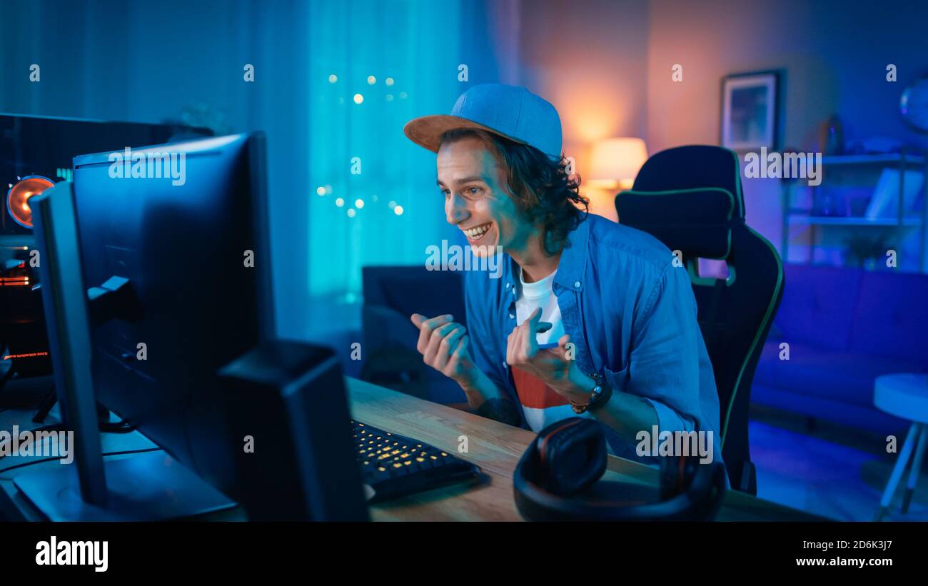 Handsome Surprised and Excited Young Man Watching an Action Video on a ...