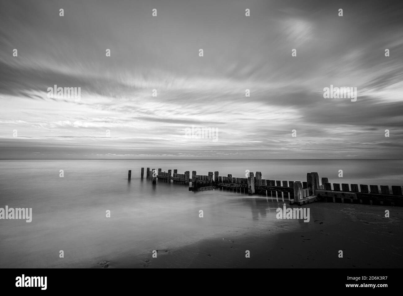 Long exposure monochrome image of sea and coast in north Norfolk ...