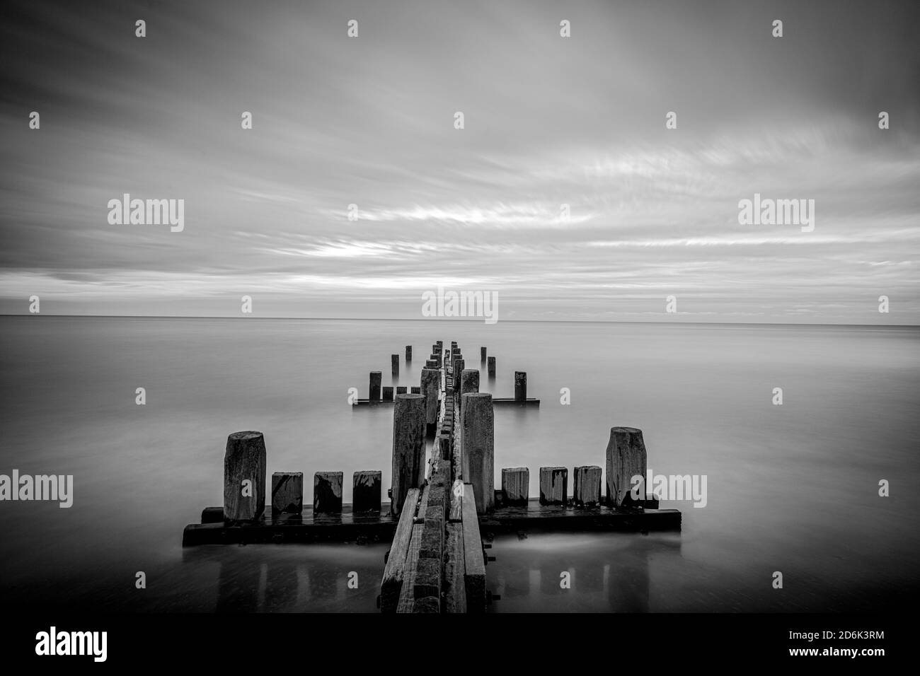 Long exposure monochrome image of sea and coast in north Norfolk ...