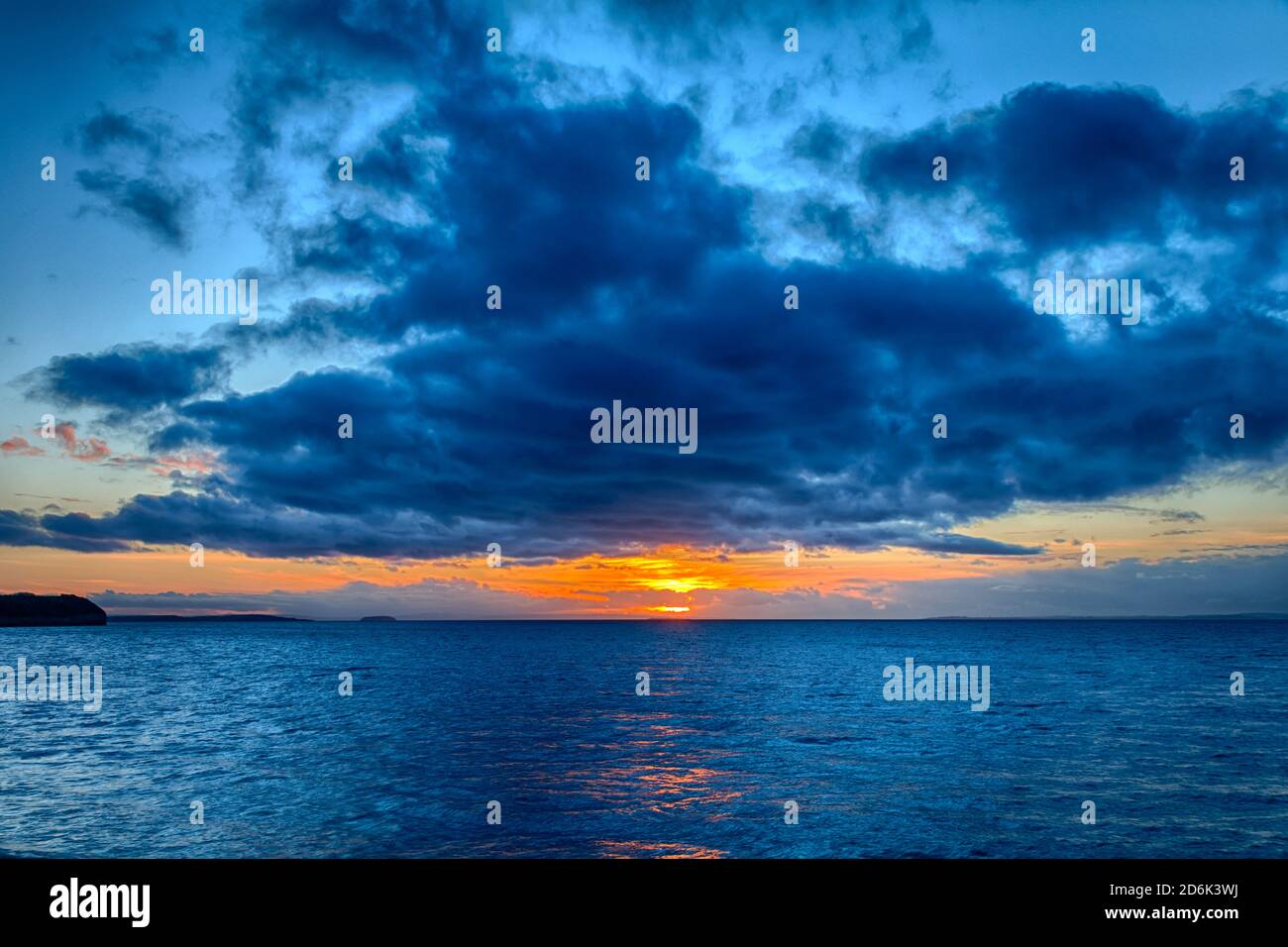 The disappeared behind some cloud cover Stock Photo - Alamy