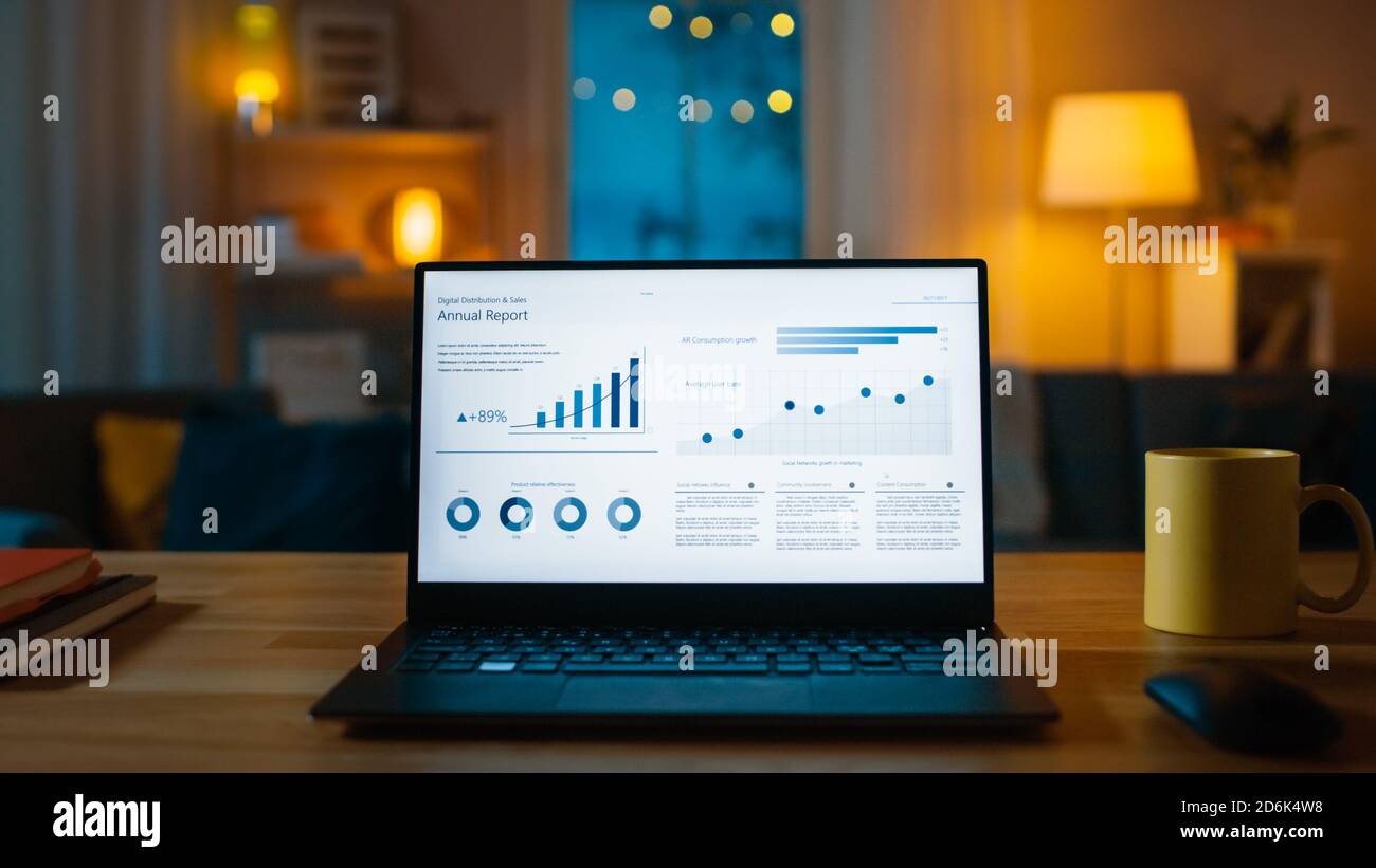 Laptop Computer Showing Statistical Infographics Stands on a Desk in ...