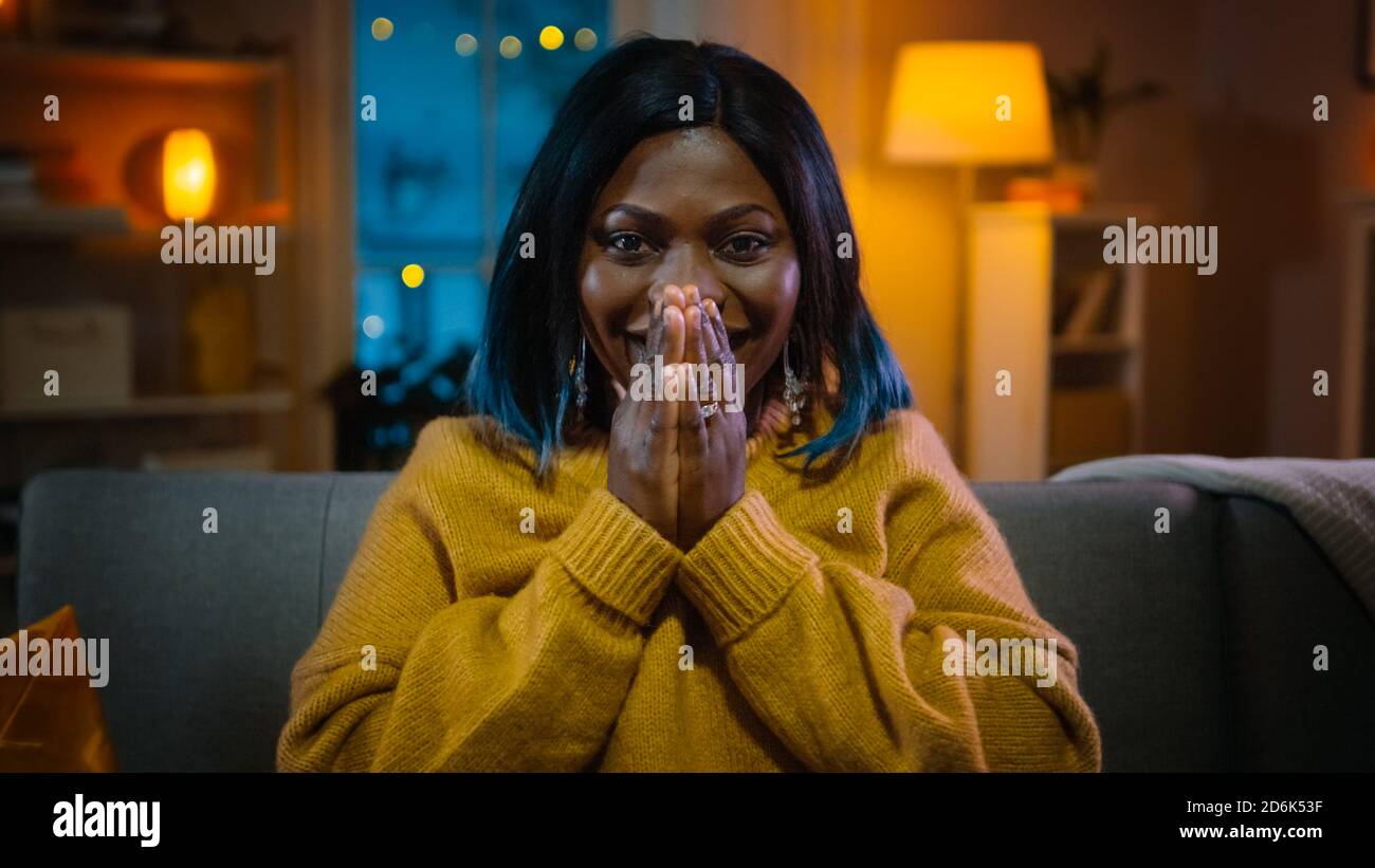 Portrait of a Beautiful Black Girl Sitting on a Couch at Home at Night ...