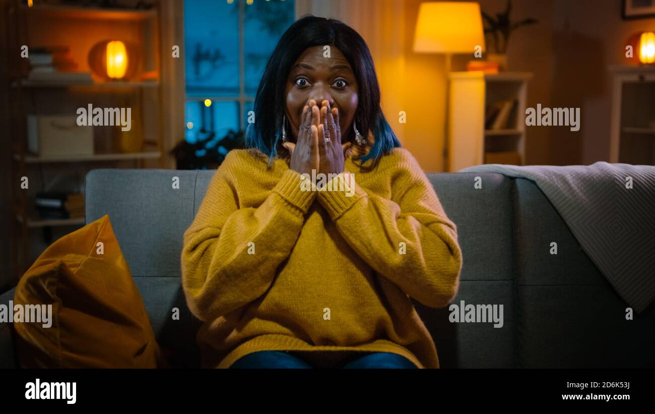 Portrait of a Beautiful Black Girl Sitting on a Couch at Home at Night ...