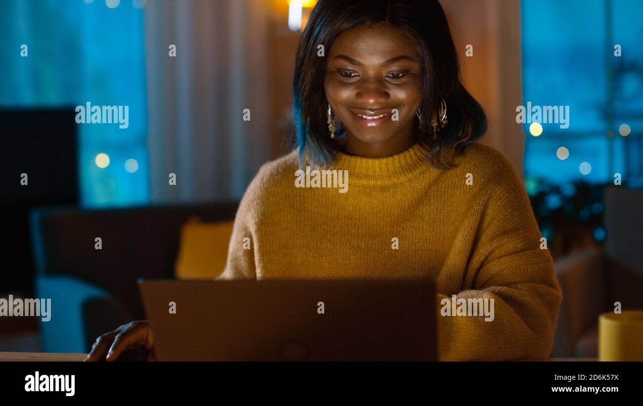 Portrait of Beautiful Smiling Black Girl Working on a Laptop while ...