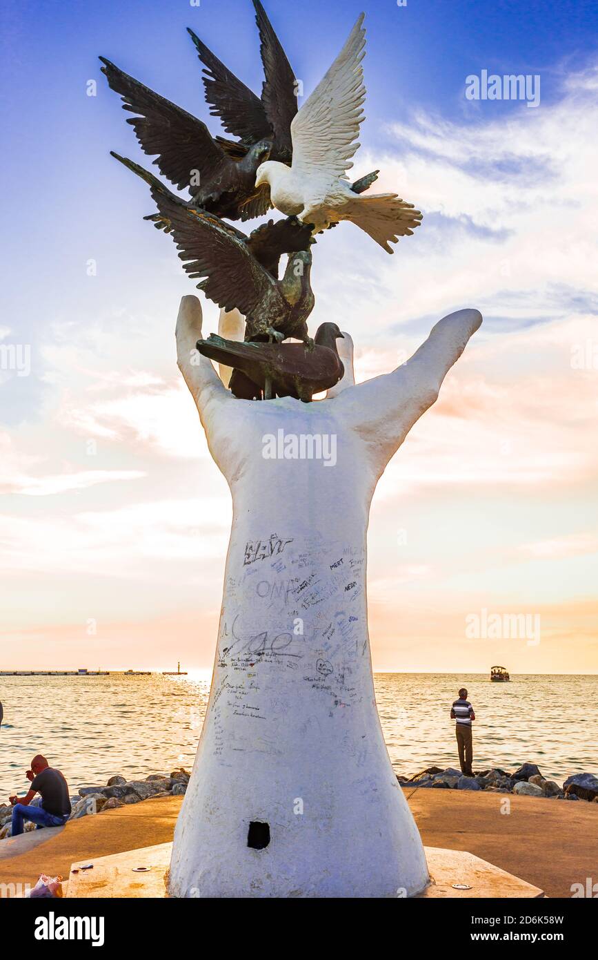 A statue of birds flying from a hand in Kusadasi, Turkey Stock Photo ...