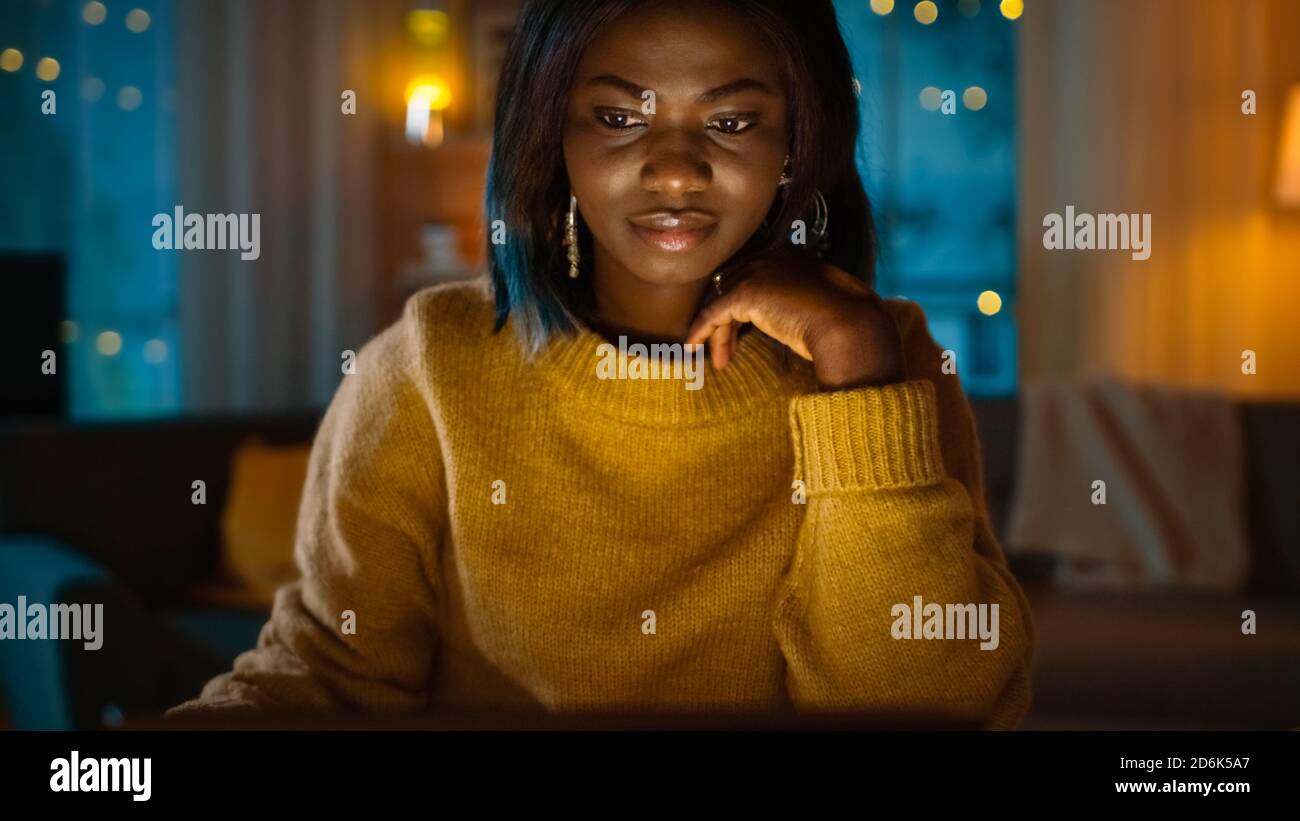 Portrait of Beautiful Black Girl Uses Computer while Sitting at Her ...