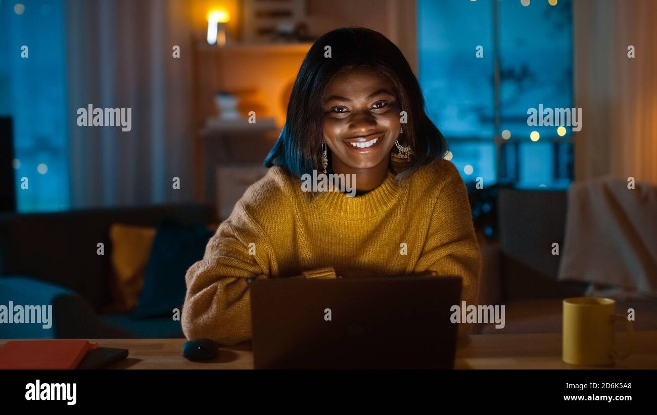 Portrait of Beautiful Black Girl Uses Computer while Sitting at Her ...