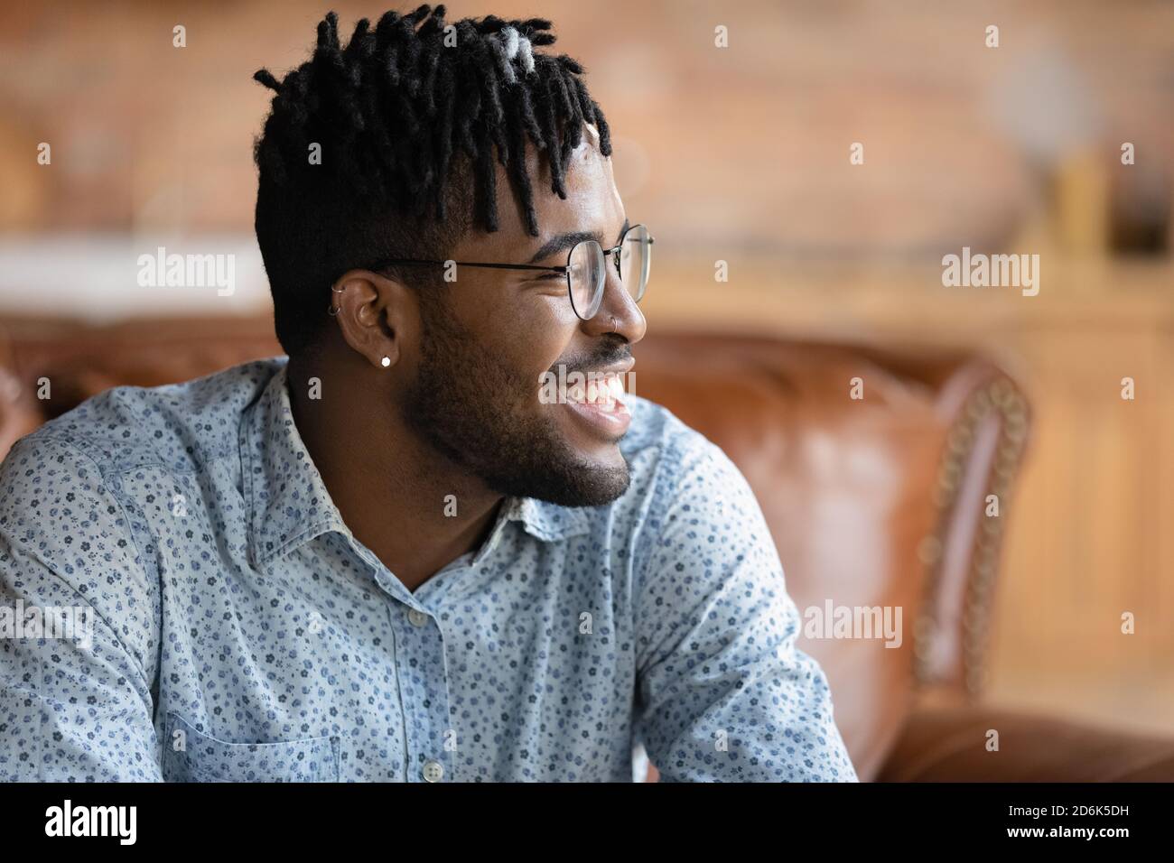 Happy African American man look in distance dreaming Stock Photo - Alamy