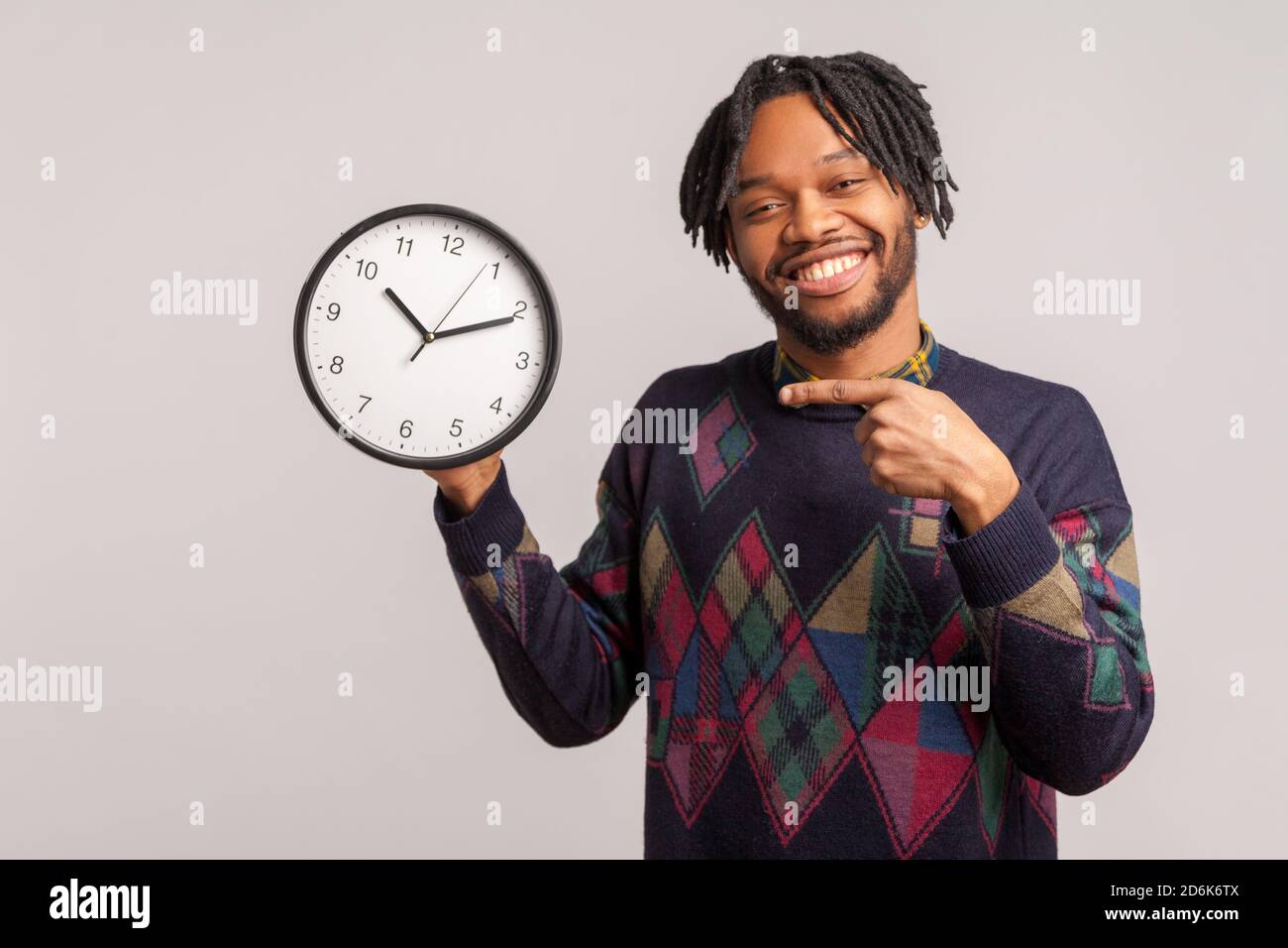Happy satisfied african guy with dreadlocks in casual sweatshirt ...