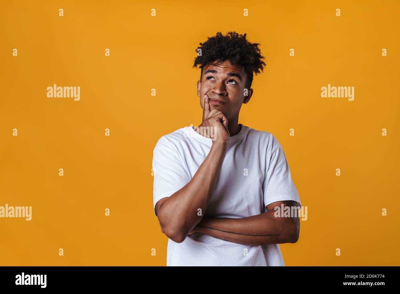 Image of brooding african american guy thinking and looking upward ...