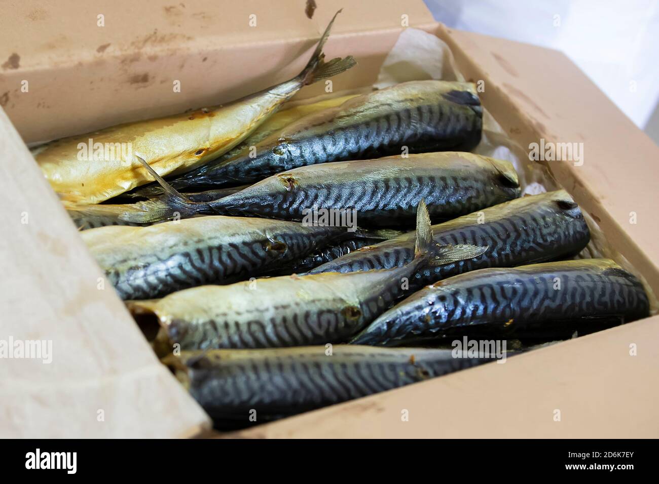 Smoked mackerel in a paper box. Fishing industry Stock Photo - Alamy