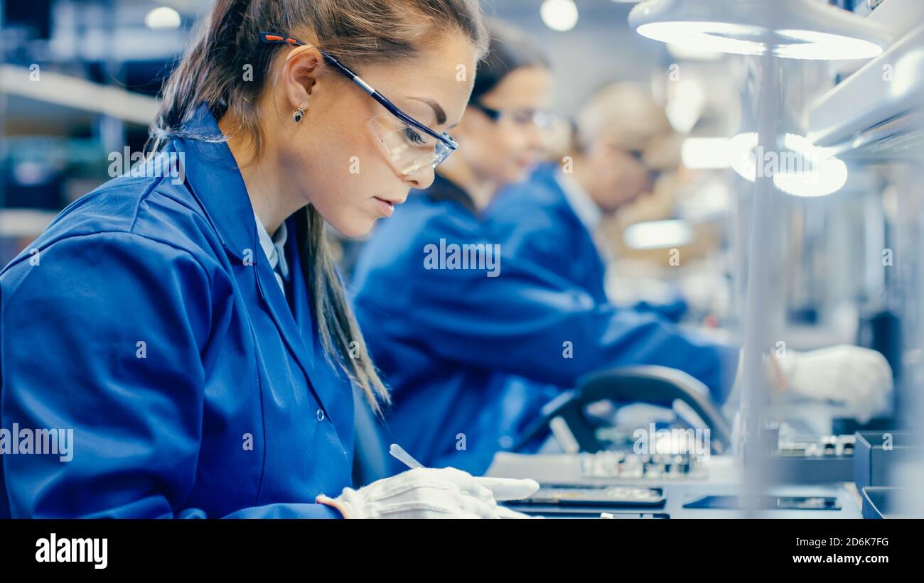 Female Electronics Factory Workers in Blue Work Coat and Protective ...