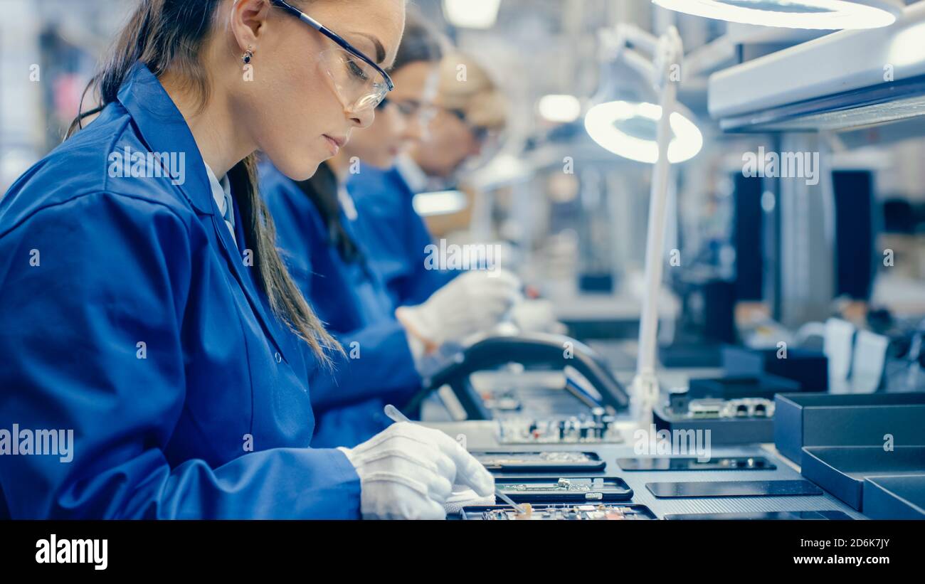 Female Electronics Factory Workers in Blue Work Coat and Protective ...