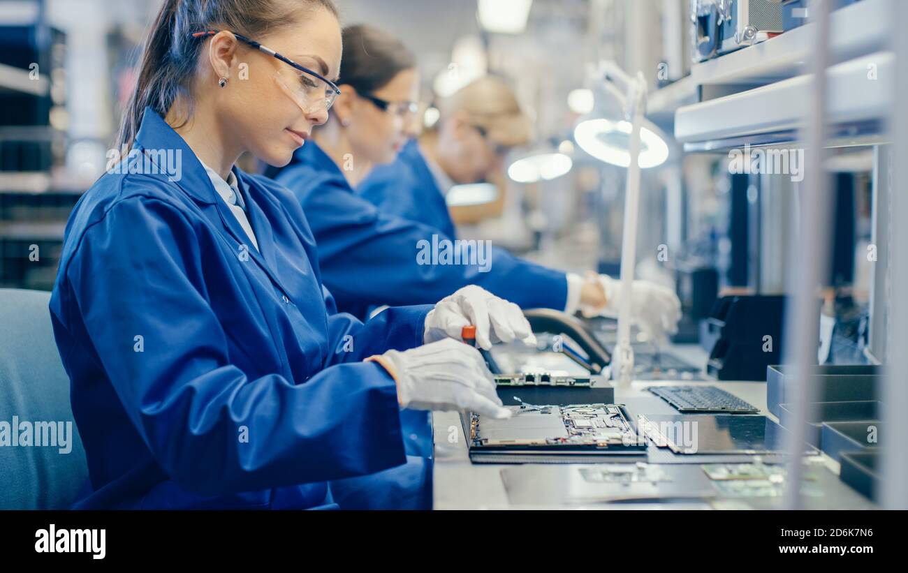 Female Electronics Factory Worker in Blue Work Coat and Protective ...