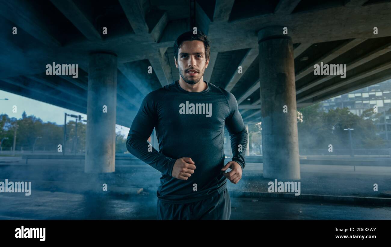 Muscular young man running under hi-res stock photography and images ...
