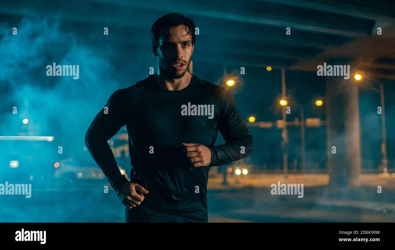 Sweating Tired Athletic Muscular Young Man in Sports Outfit Jogging in ...