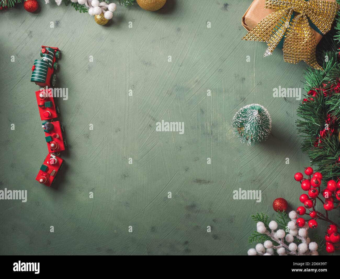 Christmas festive green background with toy train Stock Photo - Alamy