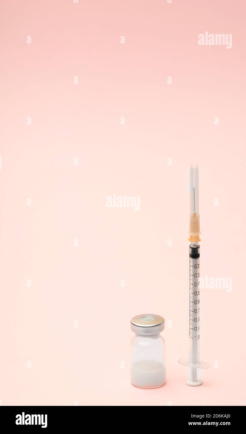 Syringe and ampules on pink background.Vaccination Stock Photo - Alamy