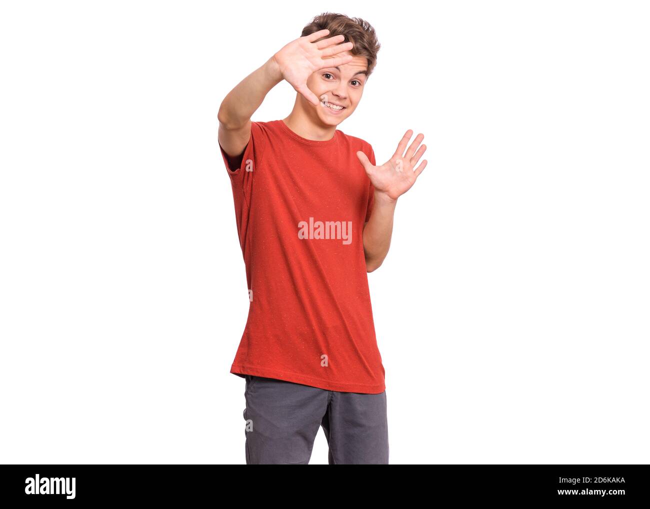 Emotional portrait of scared boy teenager, isolated on white background ...