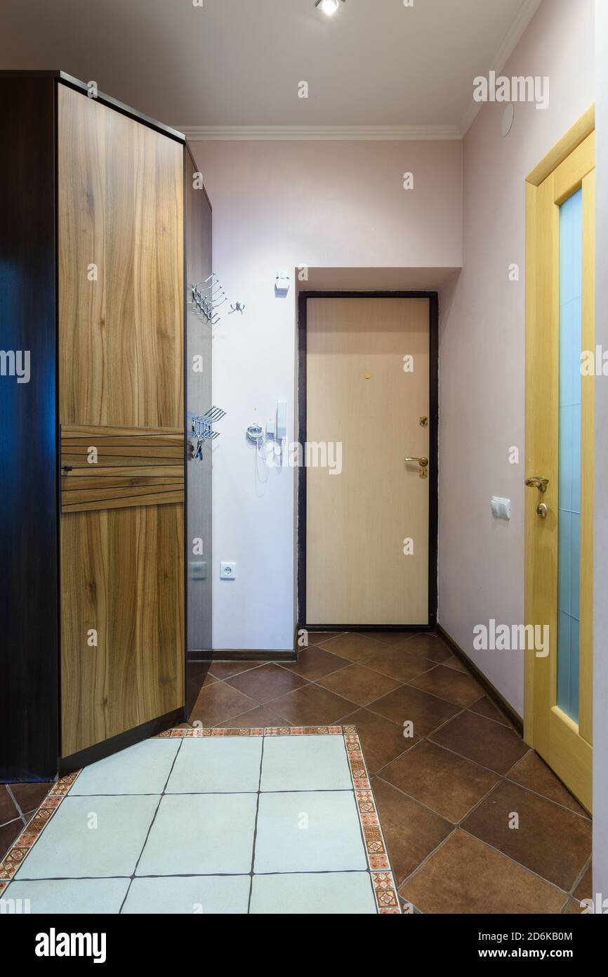 The interior of the corridor in the apartment, view of the front door ...