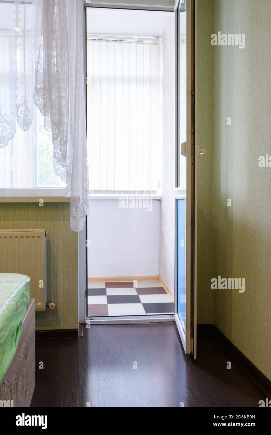 Exit from the room to the glazed balcony in the apartment Stock Photo ...