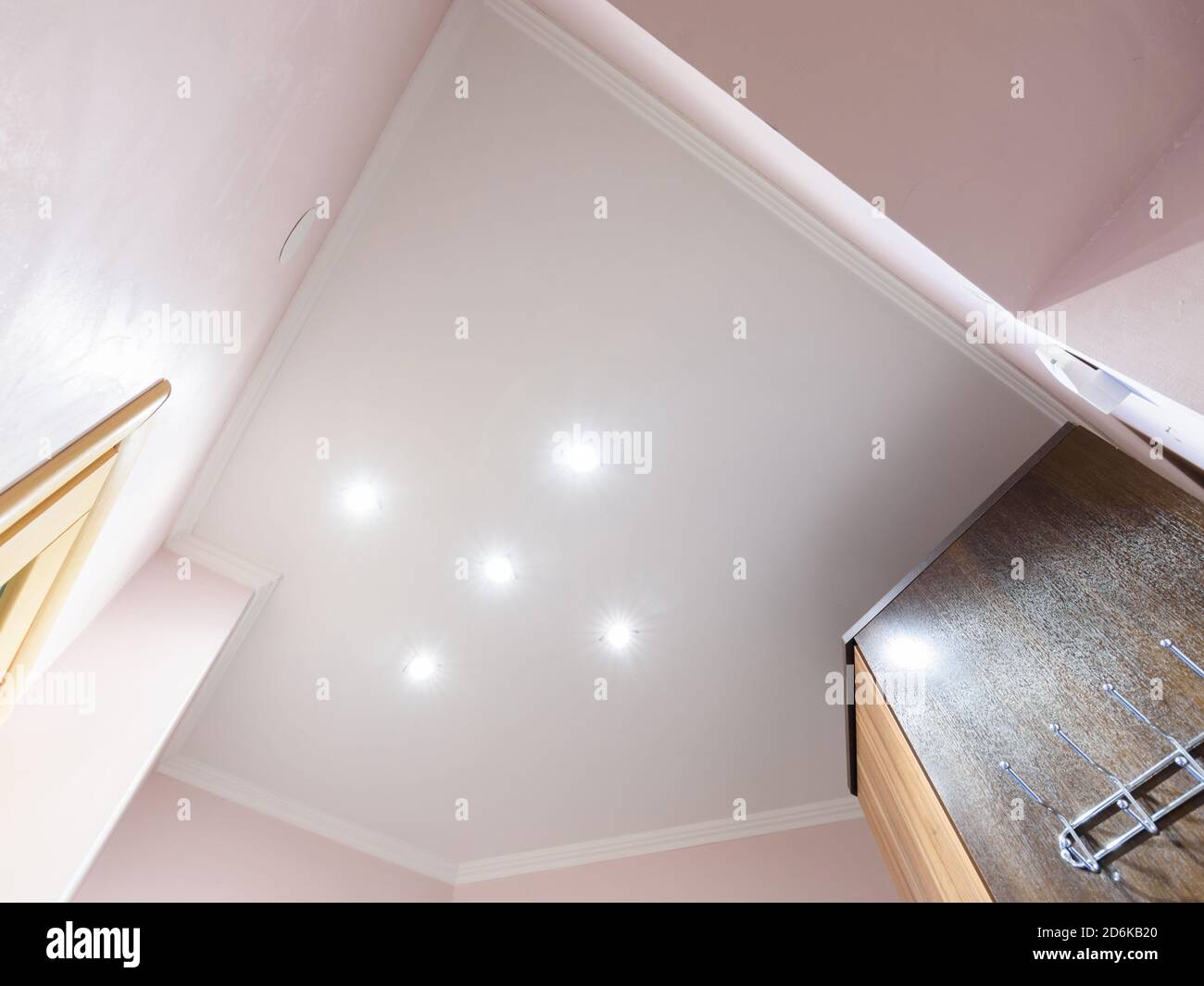 Stretch matte white ceiling in the interior of a small hallway in a ...