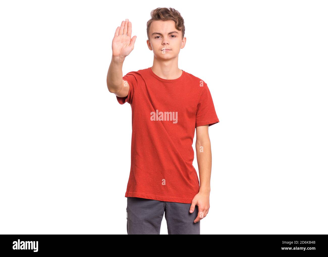 Handsome teen boy showing stop gesture with his palm, isolated on white ...