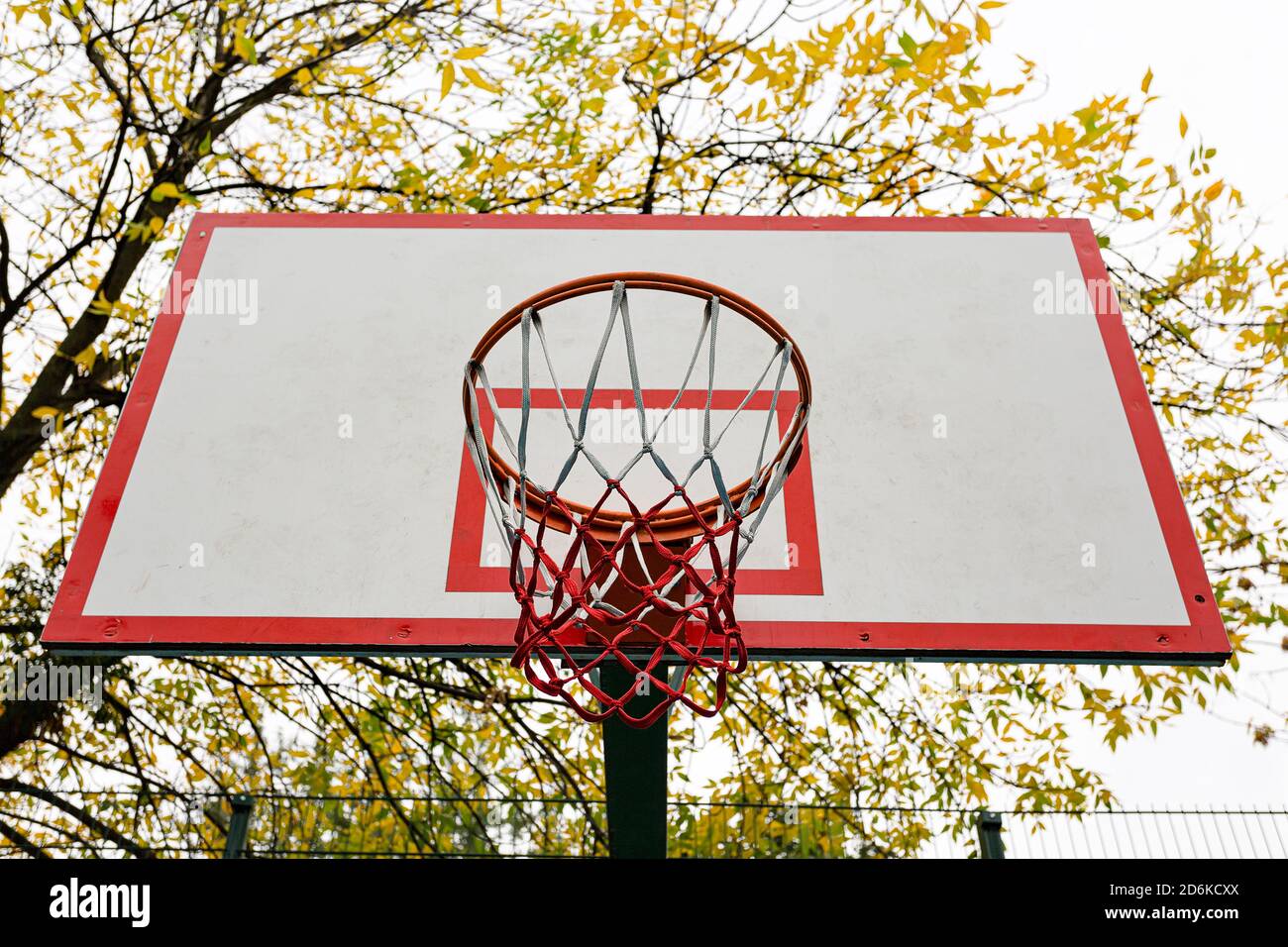 Basketball backboard with basket close-up, basketball court in the yard ...