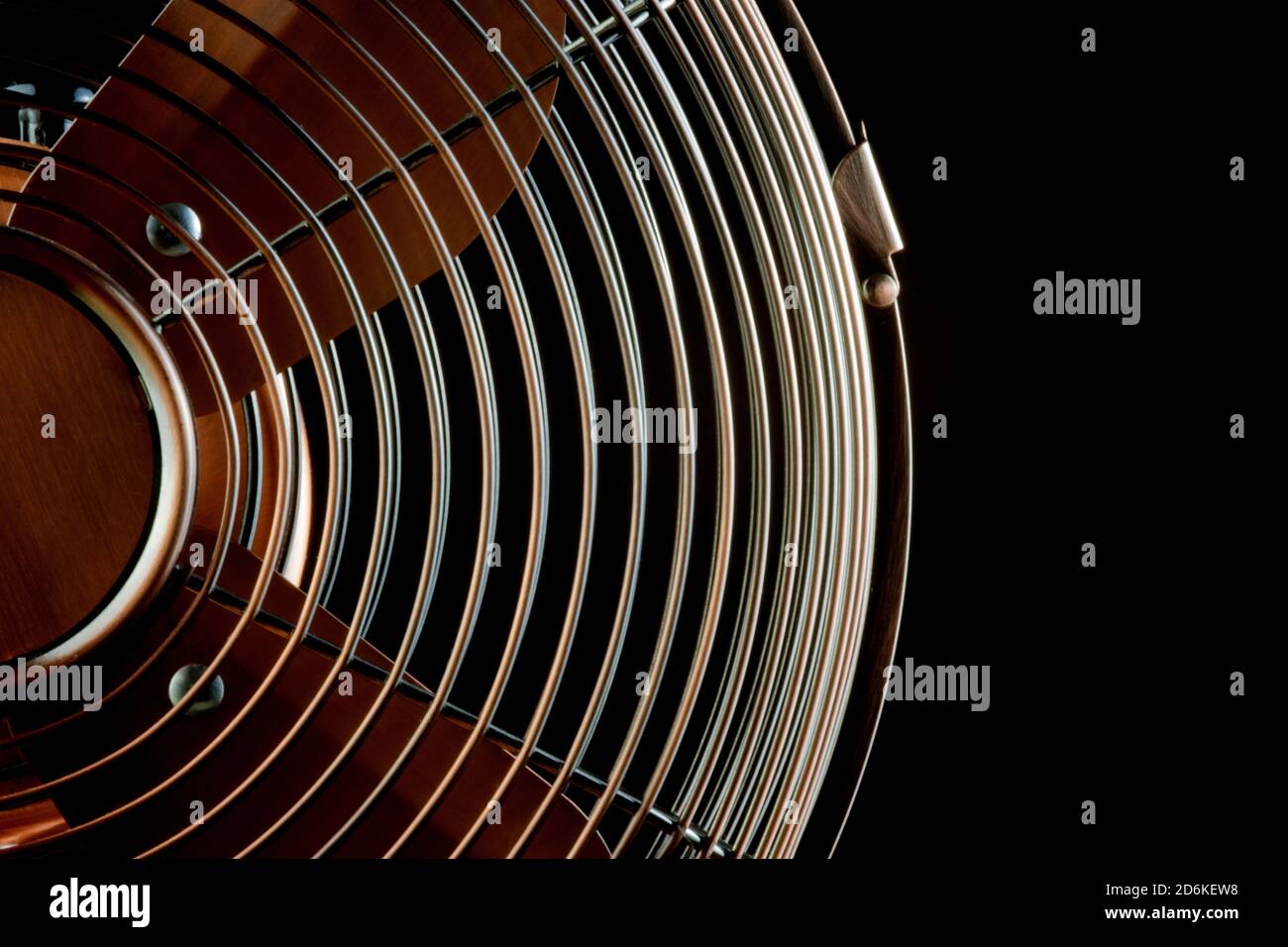 Brass desk fan section isolated against a black background Stock Photo ...