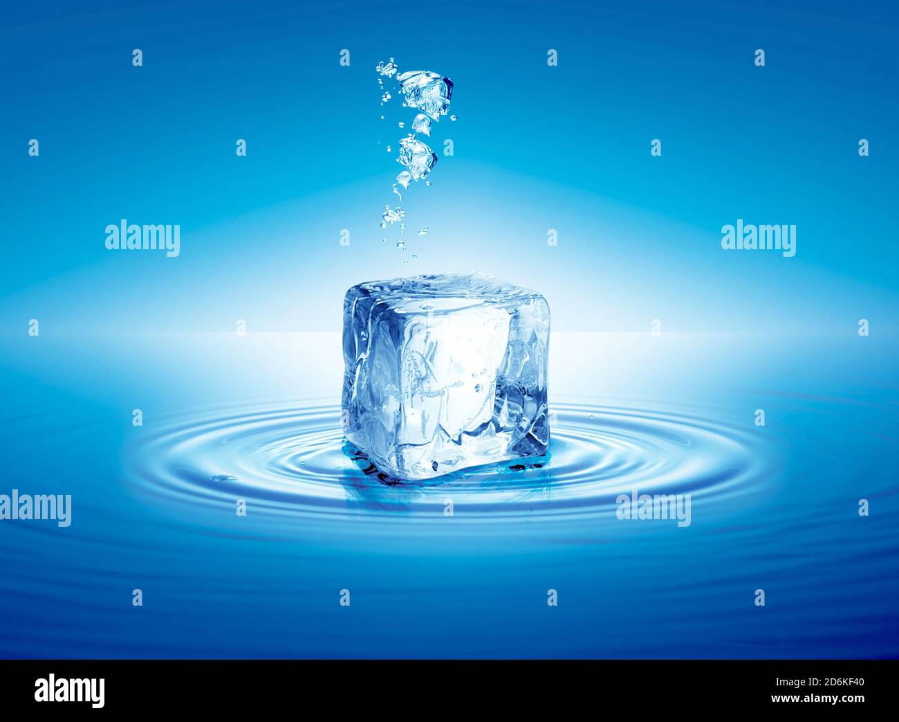 Ice cube on water surface Stock Photo - Alamy