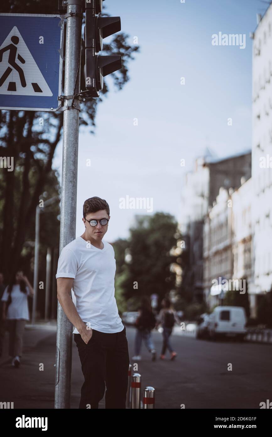 Guy stand on the city street, look camera and around Stock Photo - Alamy