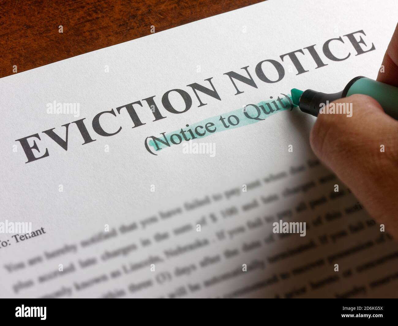 Closeup hand highlight Eviction Notice Stock Photo - Alamy