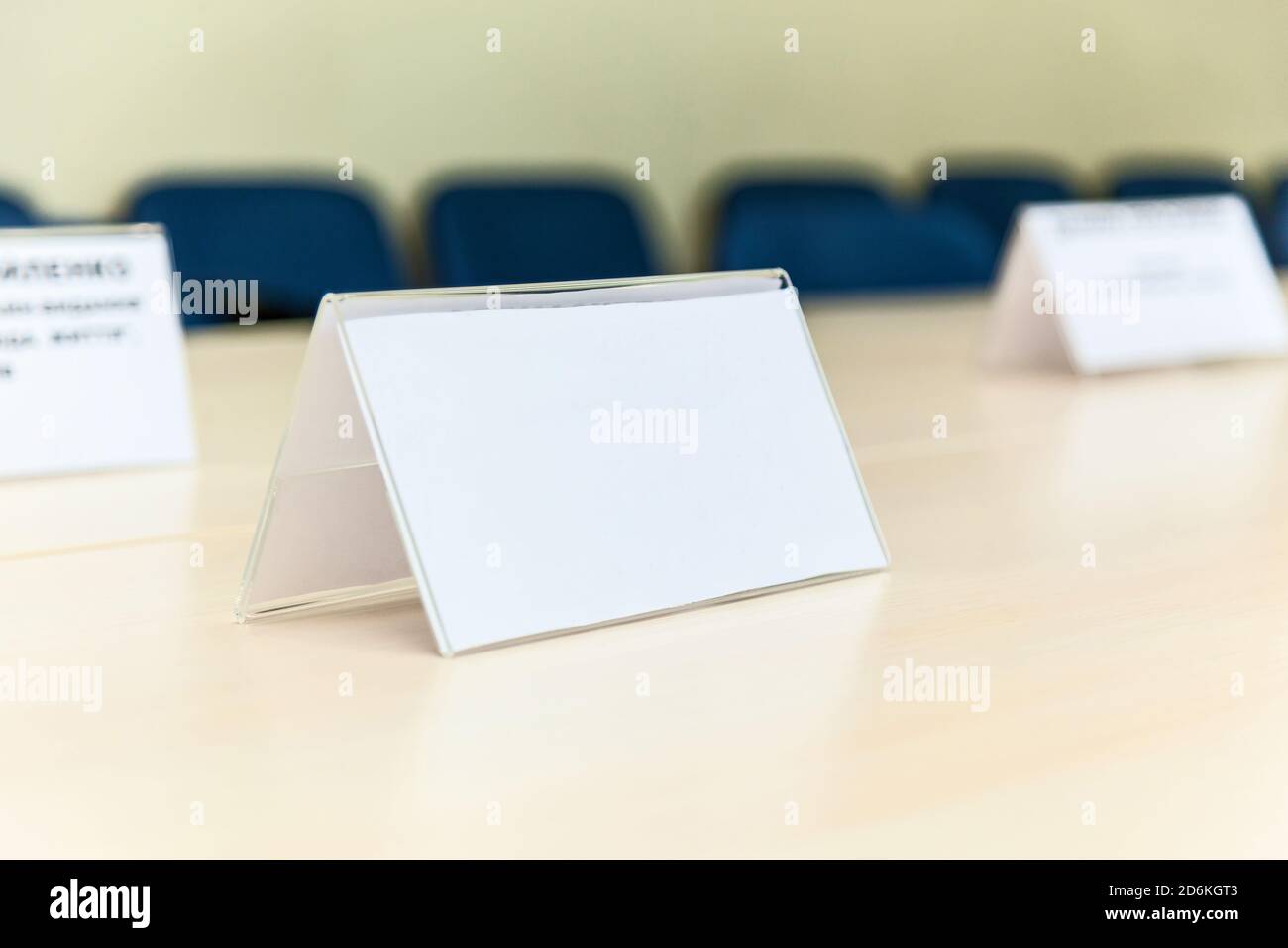 White table paper plaques on the table for conference participants ...