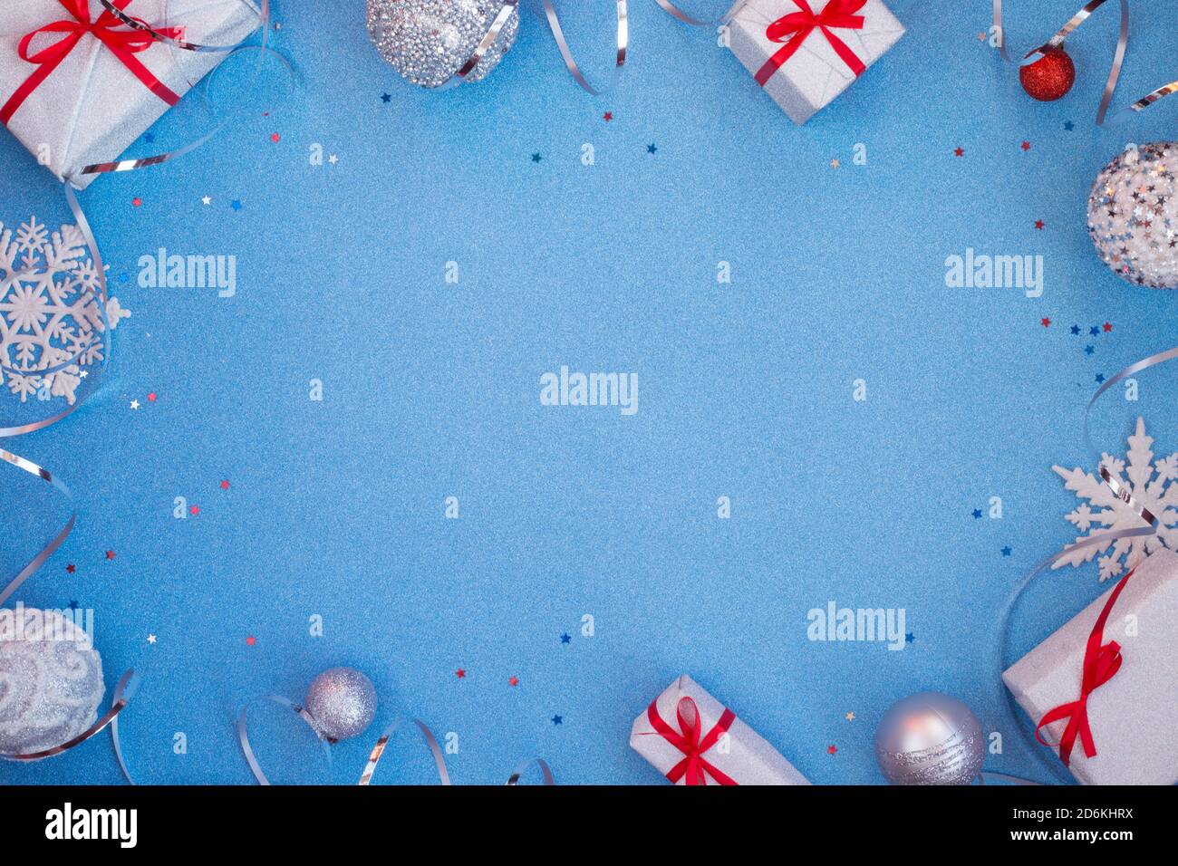 Blue glitter texture christmas background and silver gifts with red ...