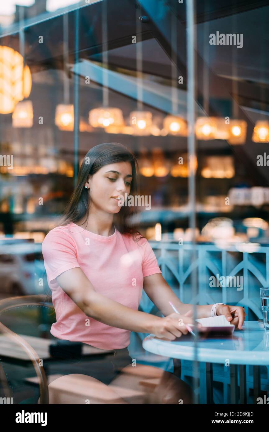 Woman posing behind bar hi-res stock photography and images - Alamy