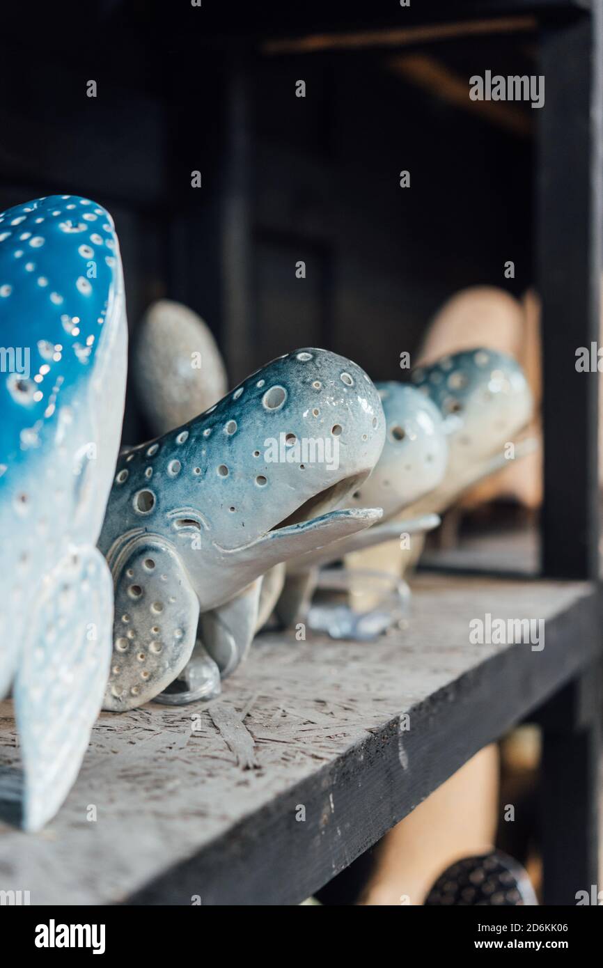 Finished pottery stands on a shelf in a pottery workshop Stock Photo ...