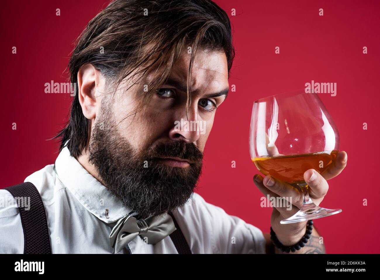 evening drink. old fashioned bearded barman. retro man in bow tie ...