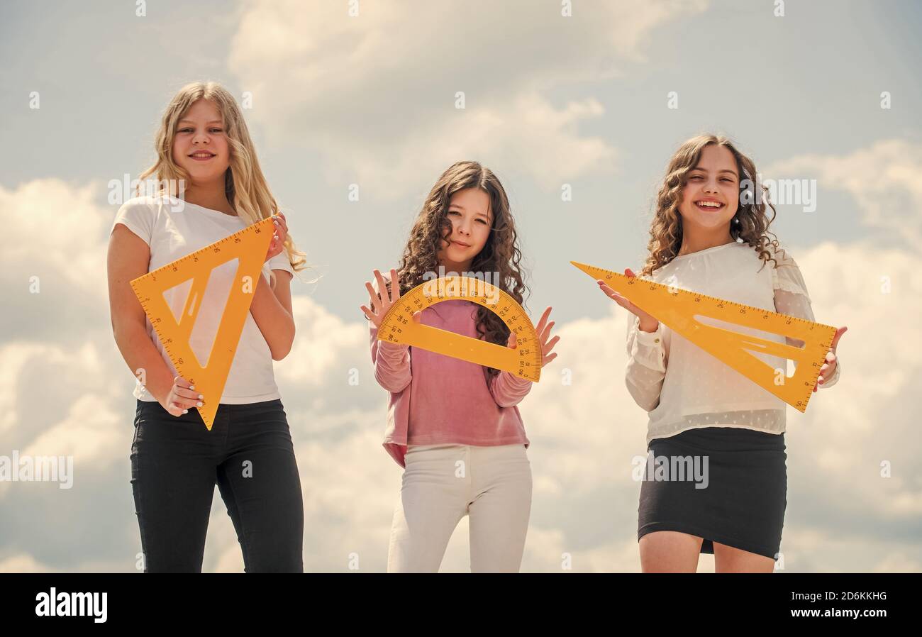 Education concept. School students learning geometry. Girls with ...