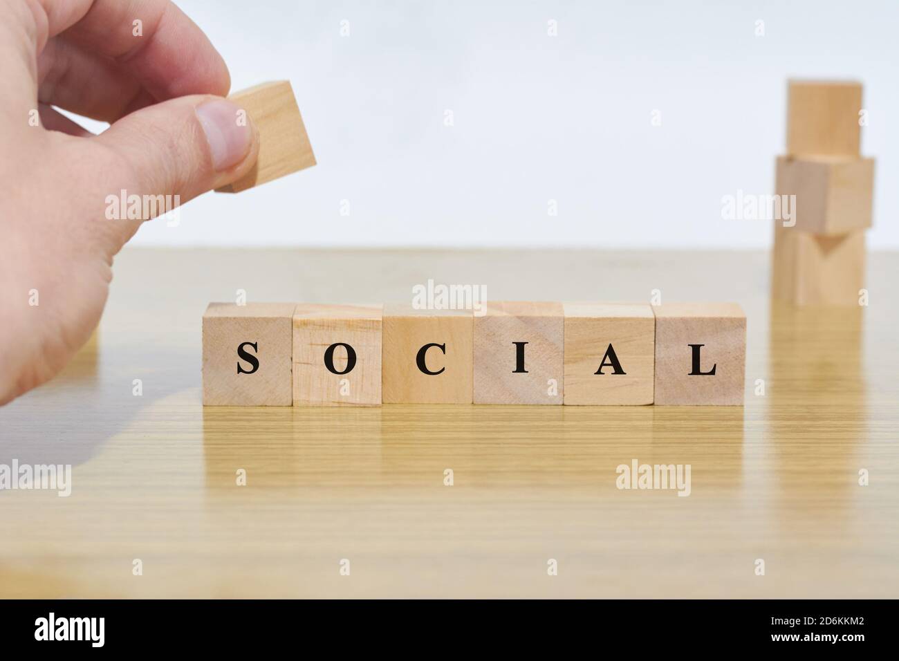 SOCIAL word written on wooden cubes blocks on light background. Hand ...