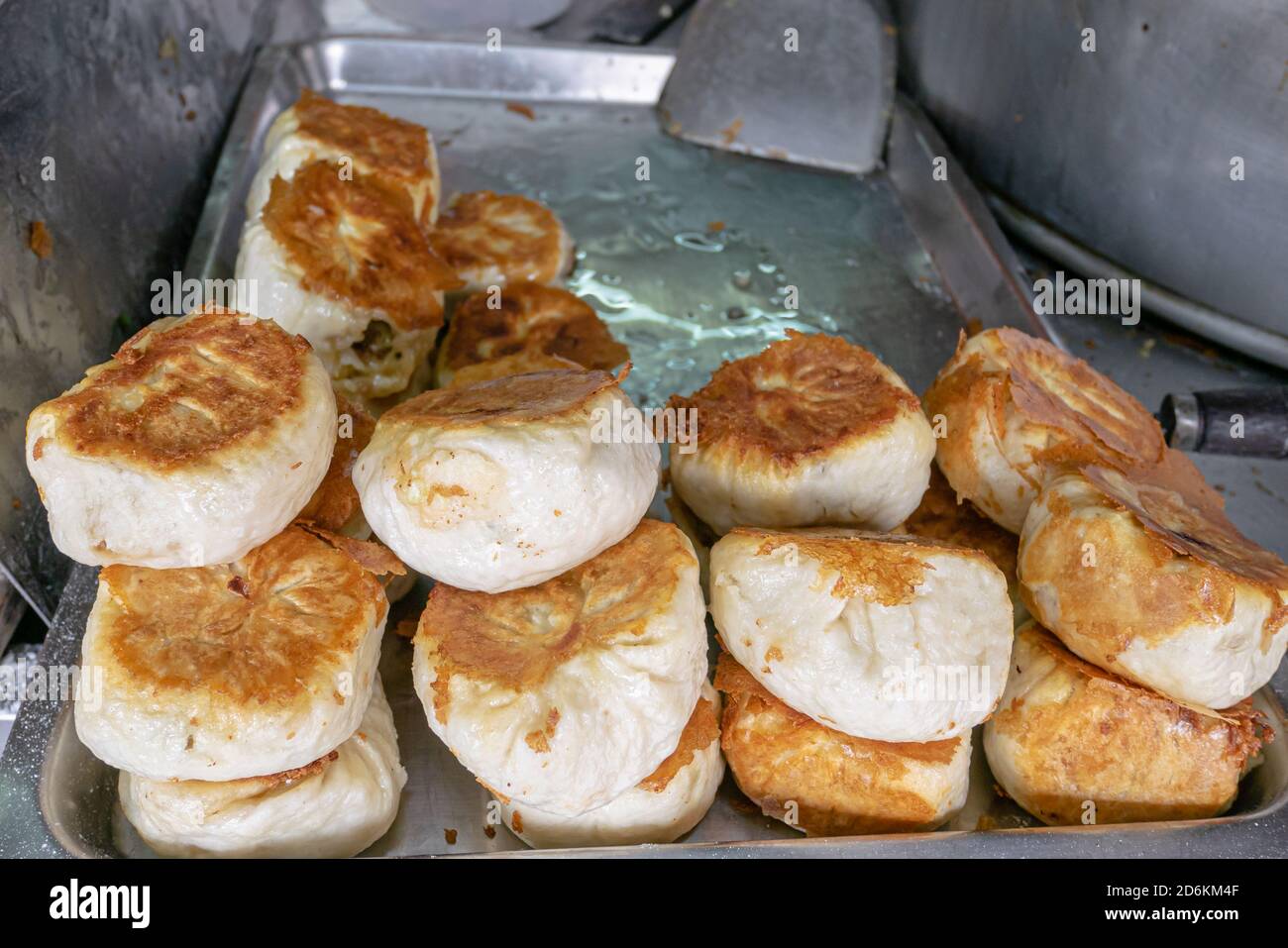 The close up of Taiwanese pan fried pork buns (Sheng Jian Bao) at food ...