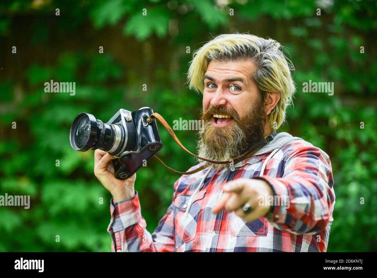 Feeling playful. Handheld shooting. man photographer do shooting ...